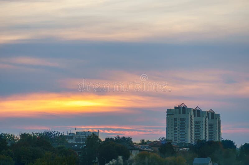Sunset in the City. the Sun Breaks through the Clouds during Sunset ...