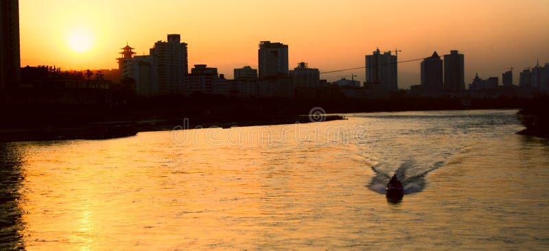 Sunset-city-yellow river stock photo. Image of silhouette - 9061316