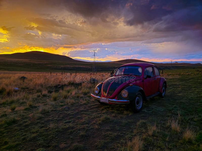 Sunset with a Classic Car in the Foreground Stock Photo - Image of ...