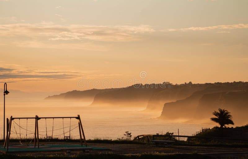 Sunset in a cliff with fog stock image. Image of sunset - 191929205