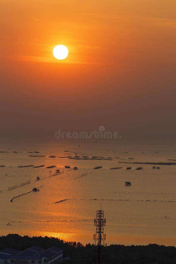 Sunset with Cloud Over Shore and Shell Farm in the Sea Stock Image ...