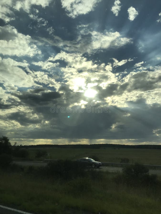Sunset through Clouds stock photo. Image of meadow, plain - 95092374