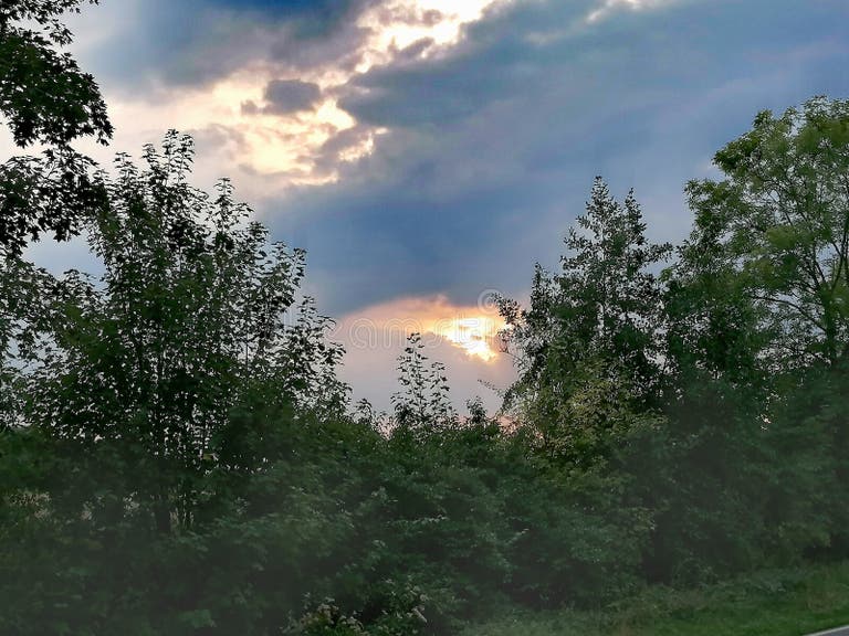 Sunset with Clouds Blue Trees Stock Photo - Image of oznormb, trees ...