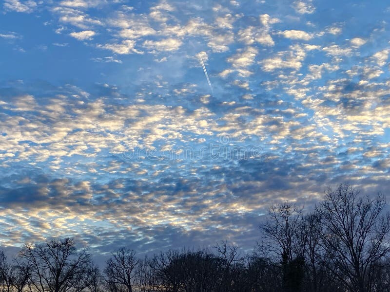 Sunset Clouds and Jet Contrail in Winter in February Stock Photo ...