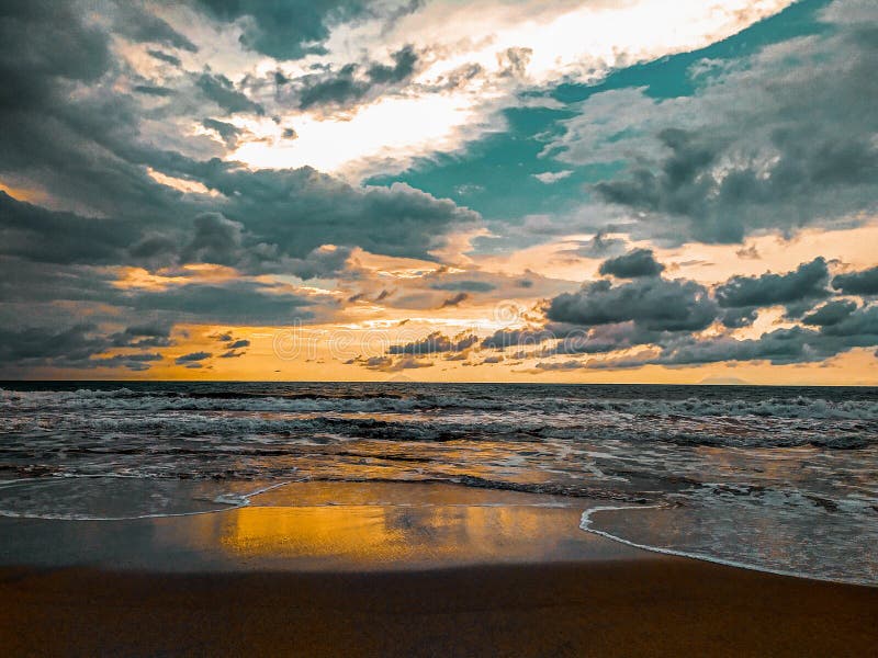 Sunset, Clouds, and Small Waves Stock Image - Image of small, beautiful ...