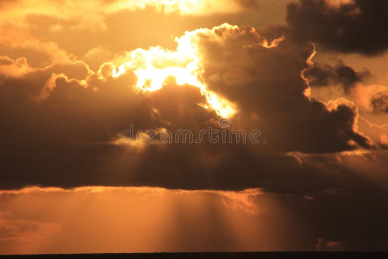 Sunset through Clouds stock photo. Image of sunny, clouds - 46298098