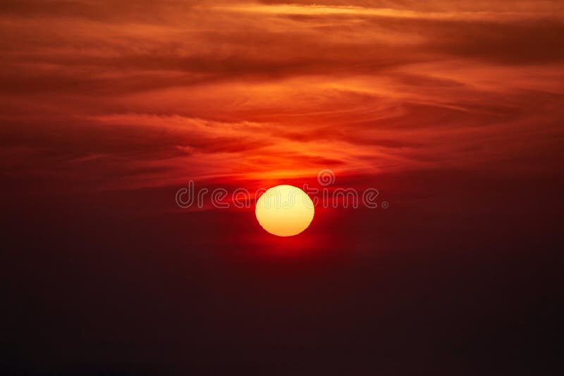 Sunset through Cloudy Red Sky Stock Photo - Image of distance, fantasy ...