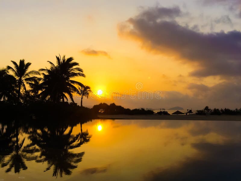 Sunset with coconut trees stock photo. Image of asia - 38094306