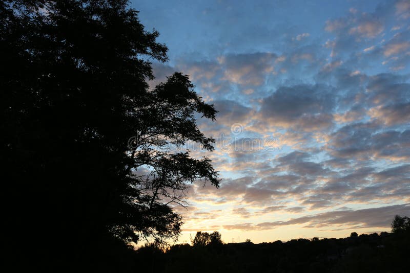 Sunset Colored Clouds in the Sky Stock Image - Image of tree, orange ...