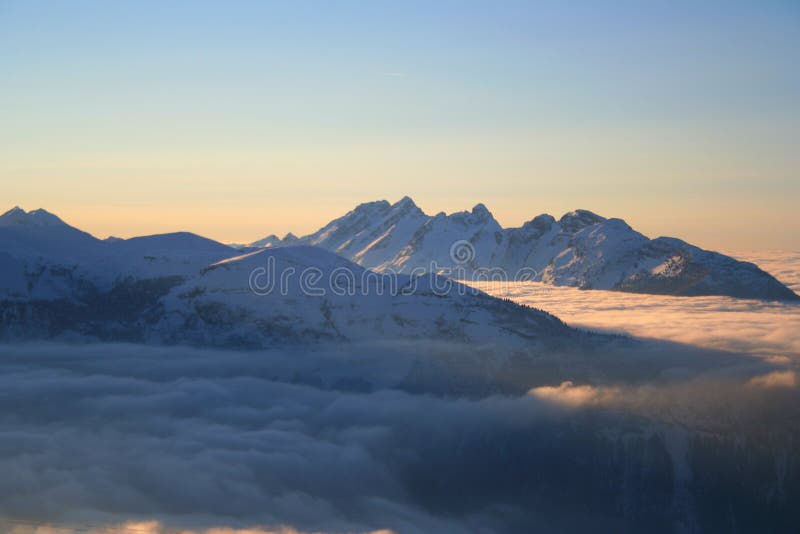 Sunrise Over the Clouds and Peaks of Wallis Alps Stock Image - Image of ...