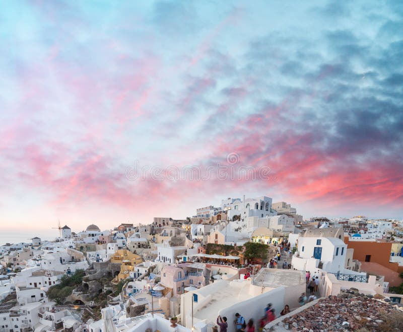 SANTORINI, GREECE - JULY 12, 2014: Tourists Enjoy Sunset in Oia ...