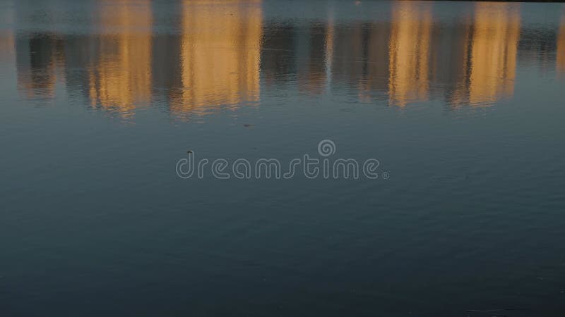 Sunset Colors on the Water Surface, Reflection of Skyscrapers in the ...