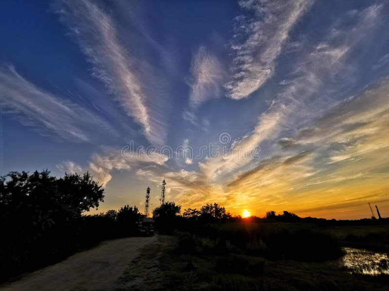 Sunset in colours stock photo. Image of reflection, cloud - 192558718