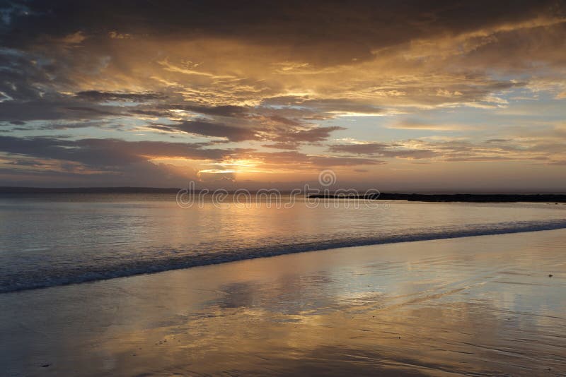 Tranquil Beach Sunset stock photo. Image of reflection - 8049174