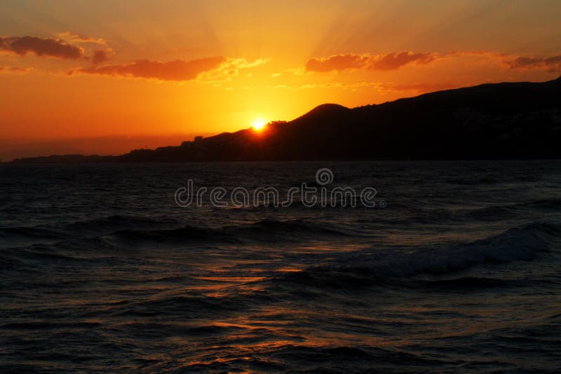 Sunset at Costa del Sol stock image. Image of shore, landscape - 16369243