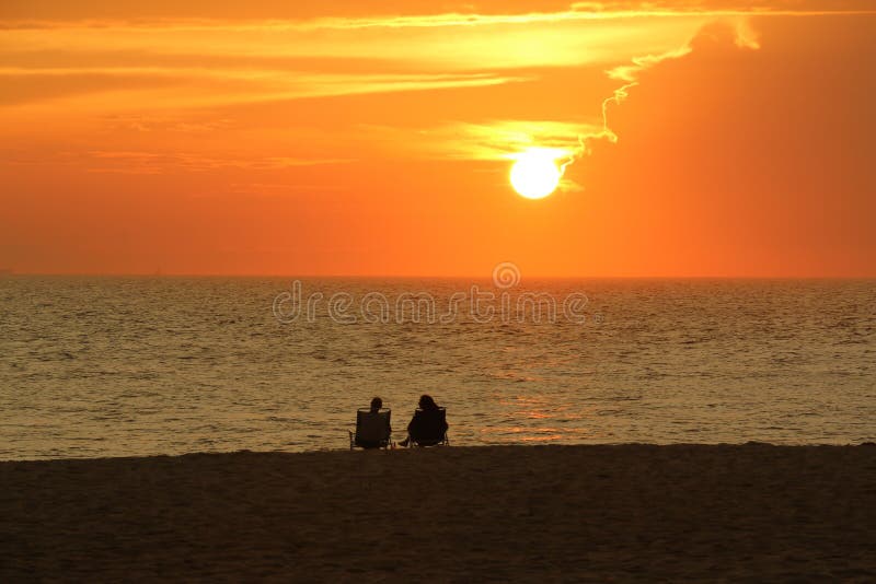 Sunset Couple 1 stock photo. Image of couples, relaxing - 75752450