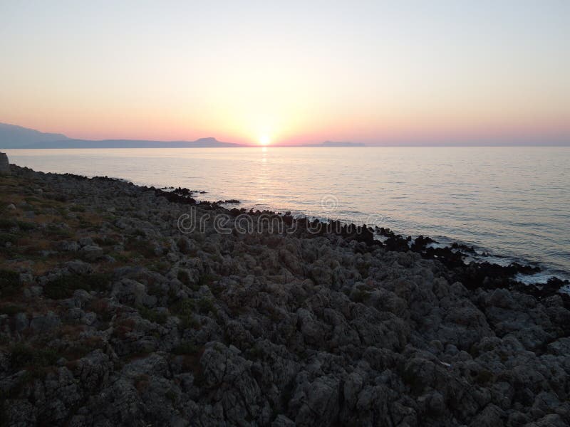 Sunset on Crete Island stock photo. Image of mediterranean - 61951046
