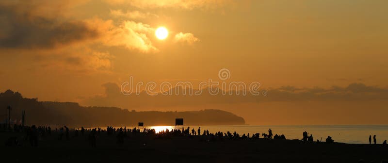 Sunset on the Crowded Beach Stock Photo - Image of playing, leisure ...