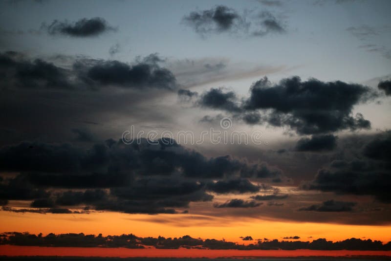 Sunset with dark clouds stock photo. Image of romantic - 231294438