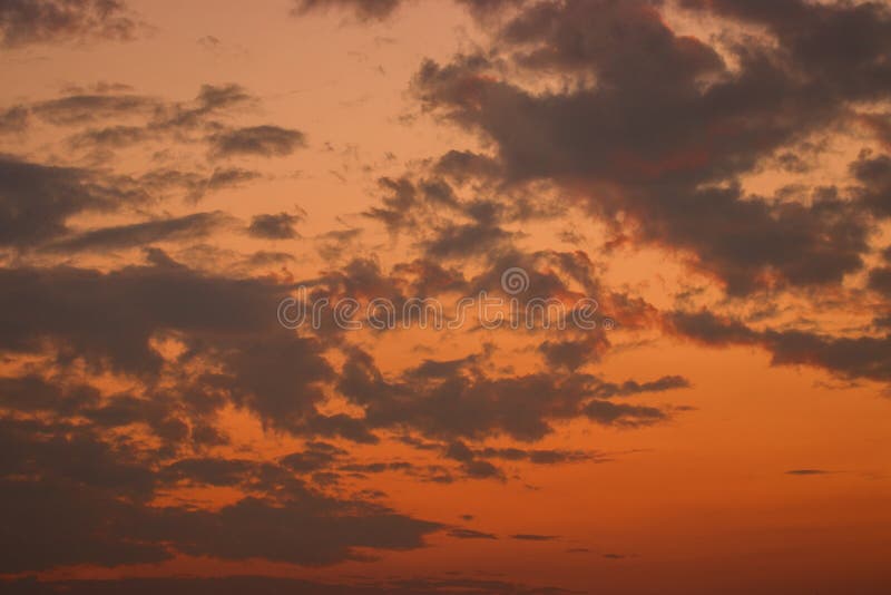 A sunset with dark clouds stock photo. Image of silhouette - 203029198