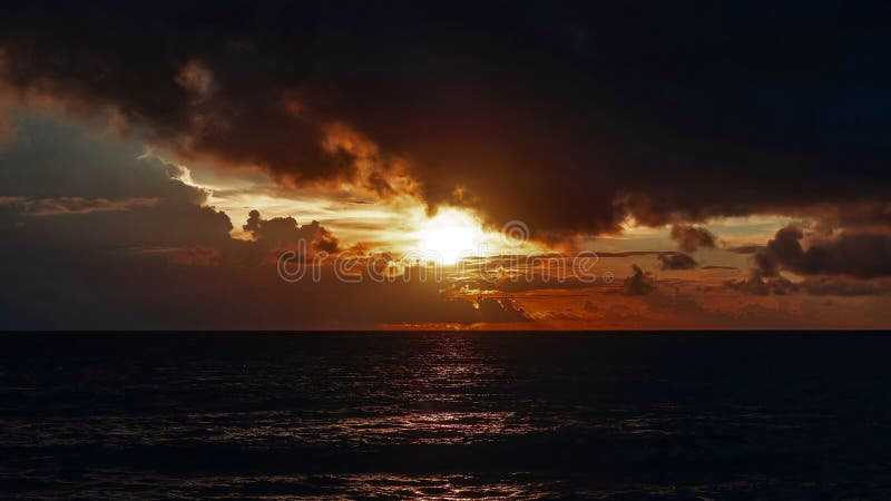 The Sunset on a Day Covered with Many Rain Clouds Stock Photo - Image ...