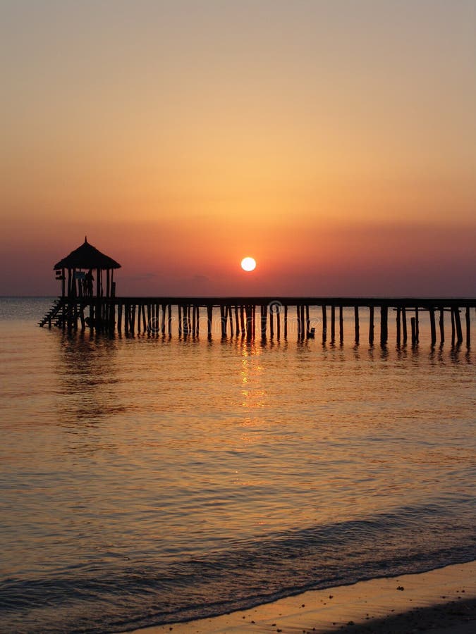 Sunset from the Deck with Hut Stock Photo - Image of people, wave: 23788442