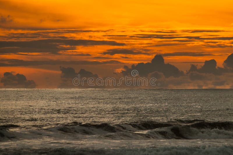 Sunset in Dominical Beach stock image. Image of storm - 55151953