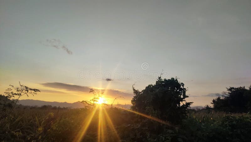 Sunset in Dompu stock image. Image of mist, night, light - 281381265