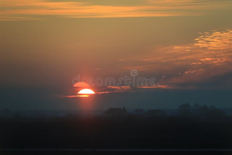 Sunset Double Sun stock photo. Image of glow, orange - 254491372