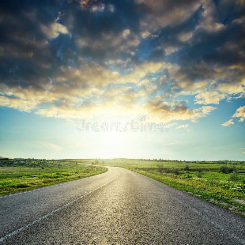 Sunset in Dramatic Clouds Over Asphalt Road Stock Photo - Image of ...