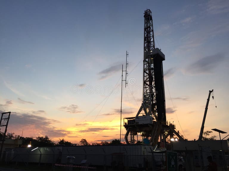 Sunset at drilling rig editorial photography. Image of sunrise - 53725352