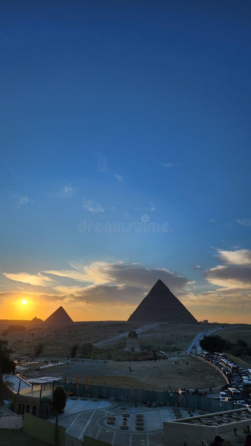 Sunset at the Egyptian Pyramids Stock Photo - Image of tourist, egypt ...