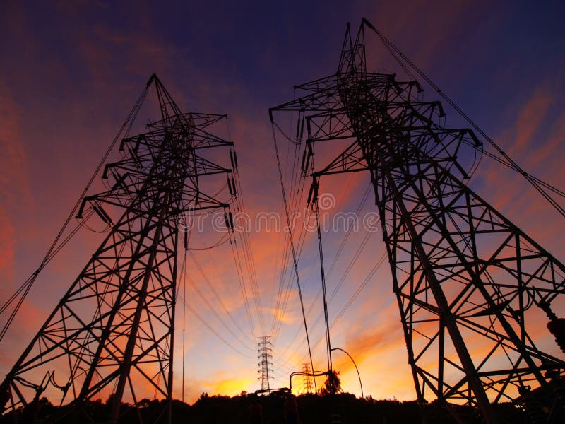 Workers Watching the Power Tower and Substation with Sunset B Stock ...