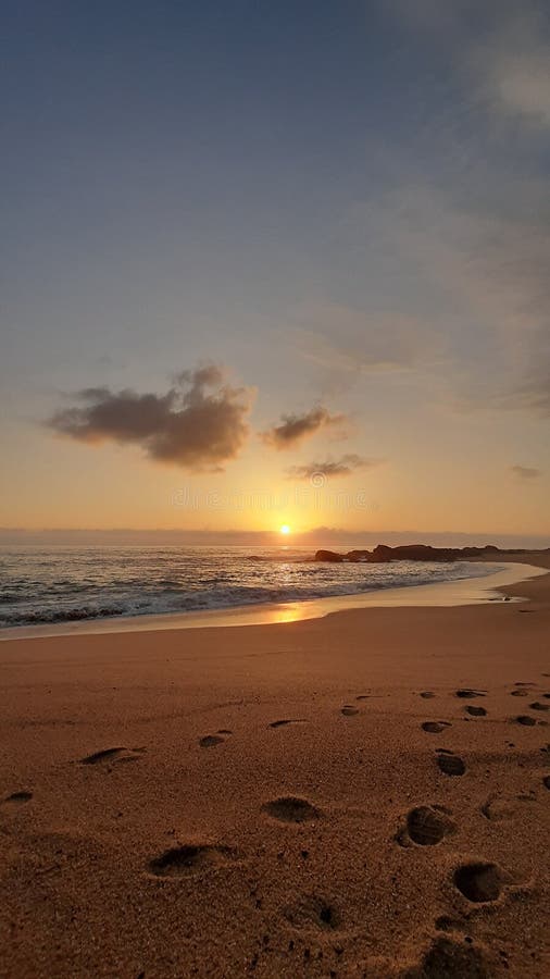 Sunset on a empty beach stock photo. Image of beach - 180779380
