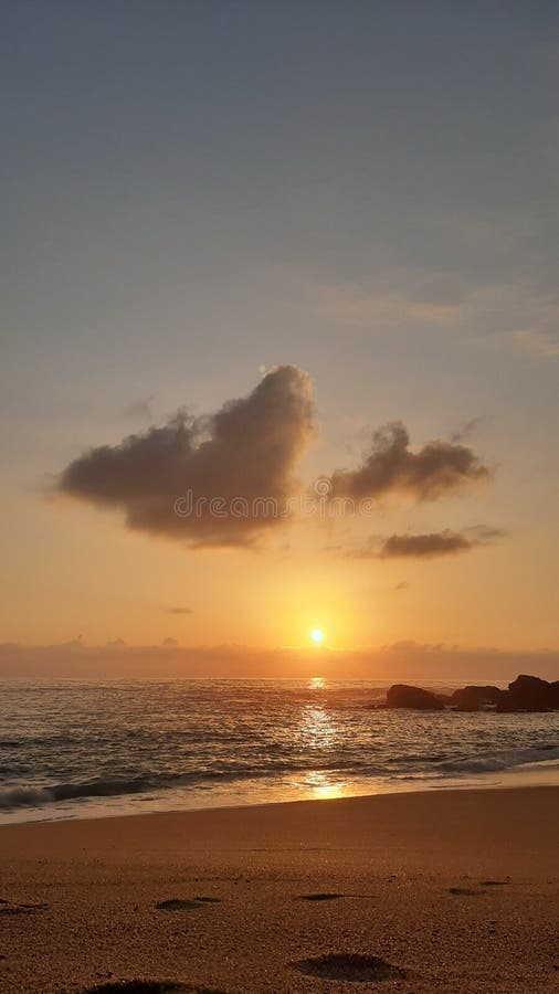 Sunset on a empty beach stock photo. Image of wood, sunlight - 180779420