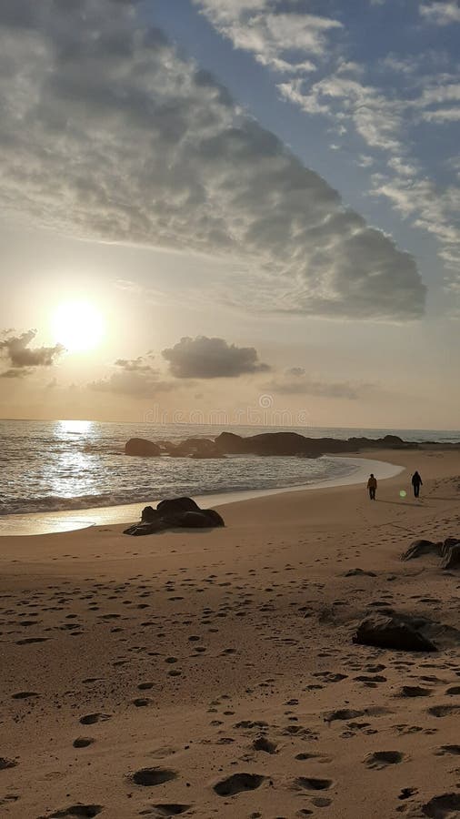 Sunset on a empty beach stock photo. Image of sunlight - 180779478