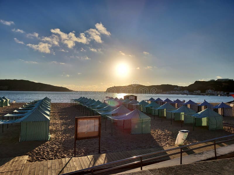 Sunset at an European Traditional Beach with Beach Cabins, on a Summer ...