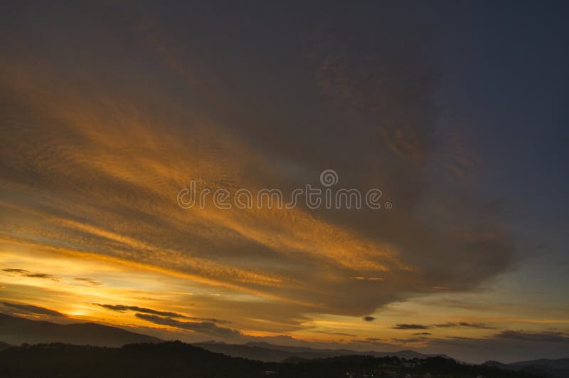 Sunset. the Evening Winter Sky in Dense Dark Clouds. Stock Image ...