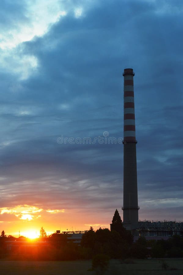 Sunset and factory chimney stock image. Image of ocean - 351562529