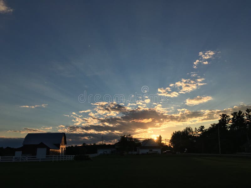 Sunset on a farm stock image. Image of clouds, farm, nature - 83933611