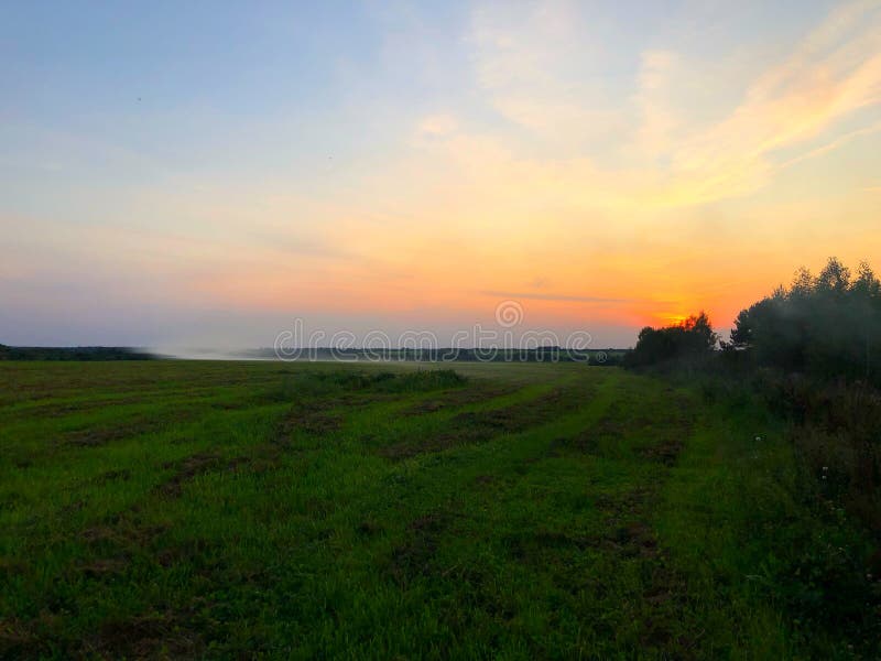 Sunset Field Fog Landscape. Sunset Fog Field View. Sunset Sky Field Fog ...