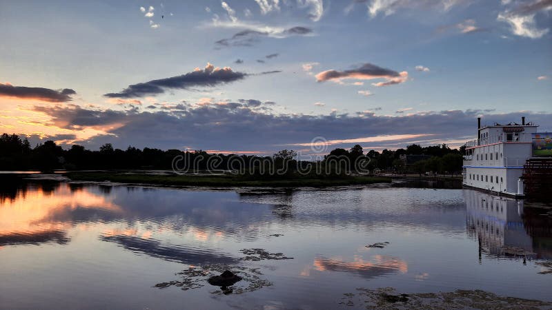 Sunset on Flat River with a View of the Showboat Stock Photo - Image of ...