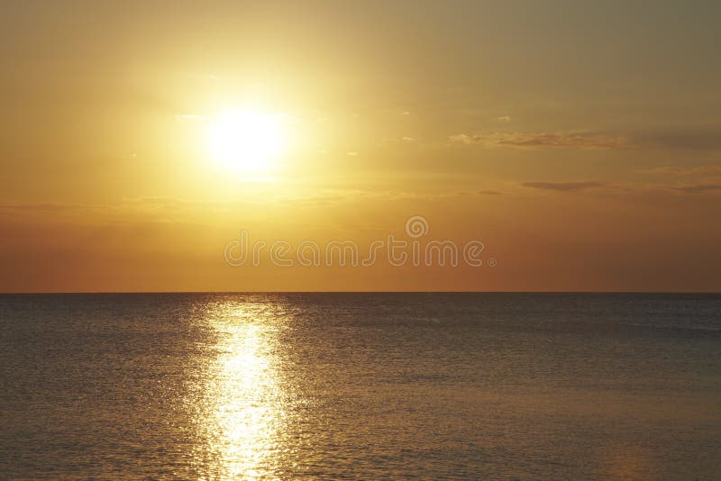 Sunset on the Flat Sea. Light Orange Reflection on the Waves Stock ...