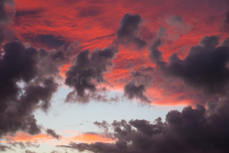 Sunset with fluffy clouds stock image. Image of blue - 42197625