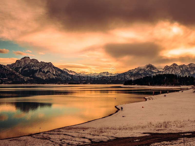 Sunset at the Forggensee stock image. Image of fuessen - 214860863