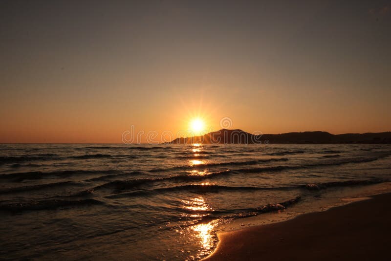 Sunset form greek beach stock image. Image of pink, tide - 181156615