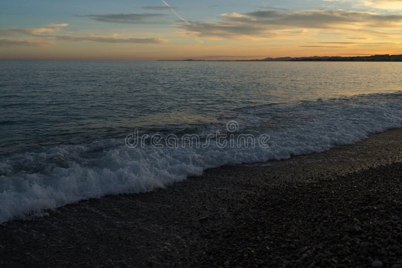 Sunset on the French Riviera Pebble Beach in Nice Stock Image - Image ...