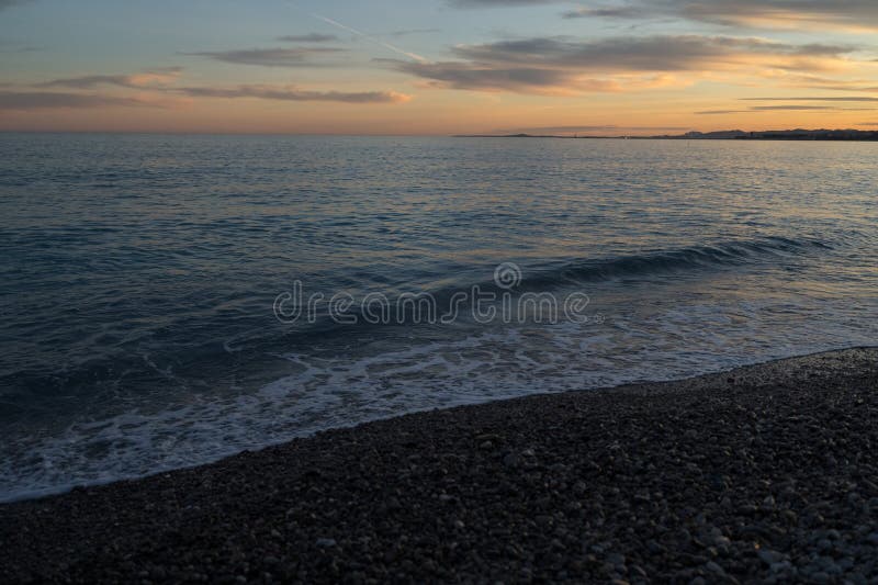 Sunset on the French Riviera Pebble Beach in Nice Stock Image - Image ...