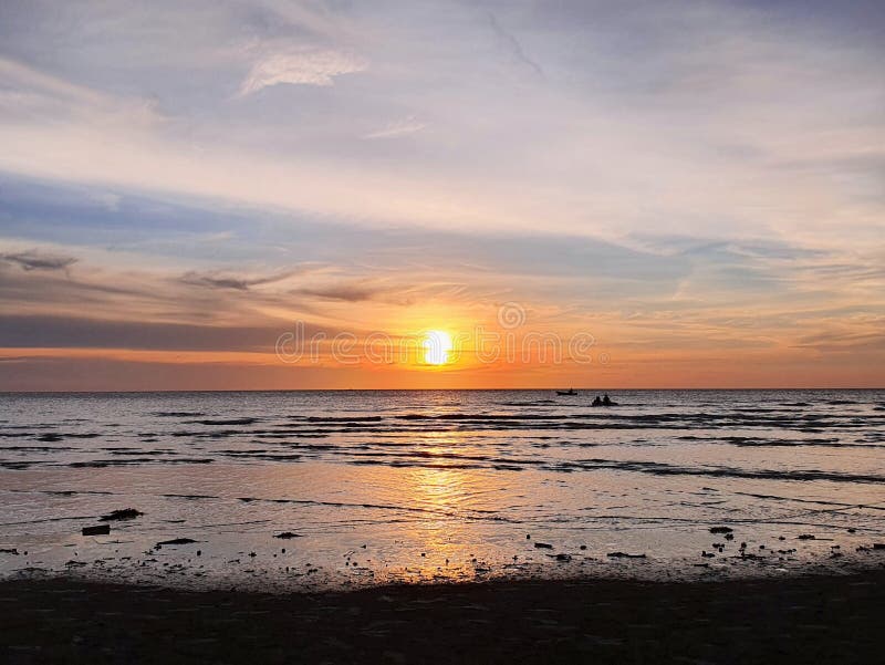 Sunset Gazing in the Sea stock photo. Image of beachscenery - 247760368