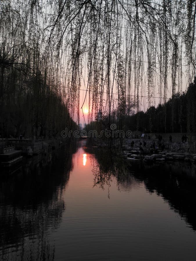 The Sunset Glow is Reflected in the Spring at Dusk Stock Image - Image ...